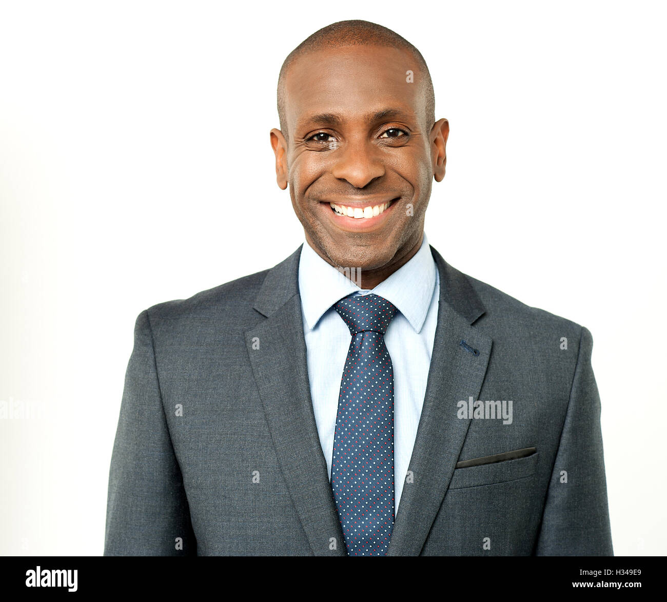 Smiling relaxed corporate man posing Stock Photo - Alamy