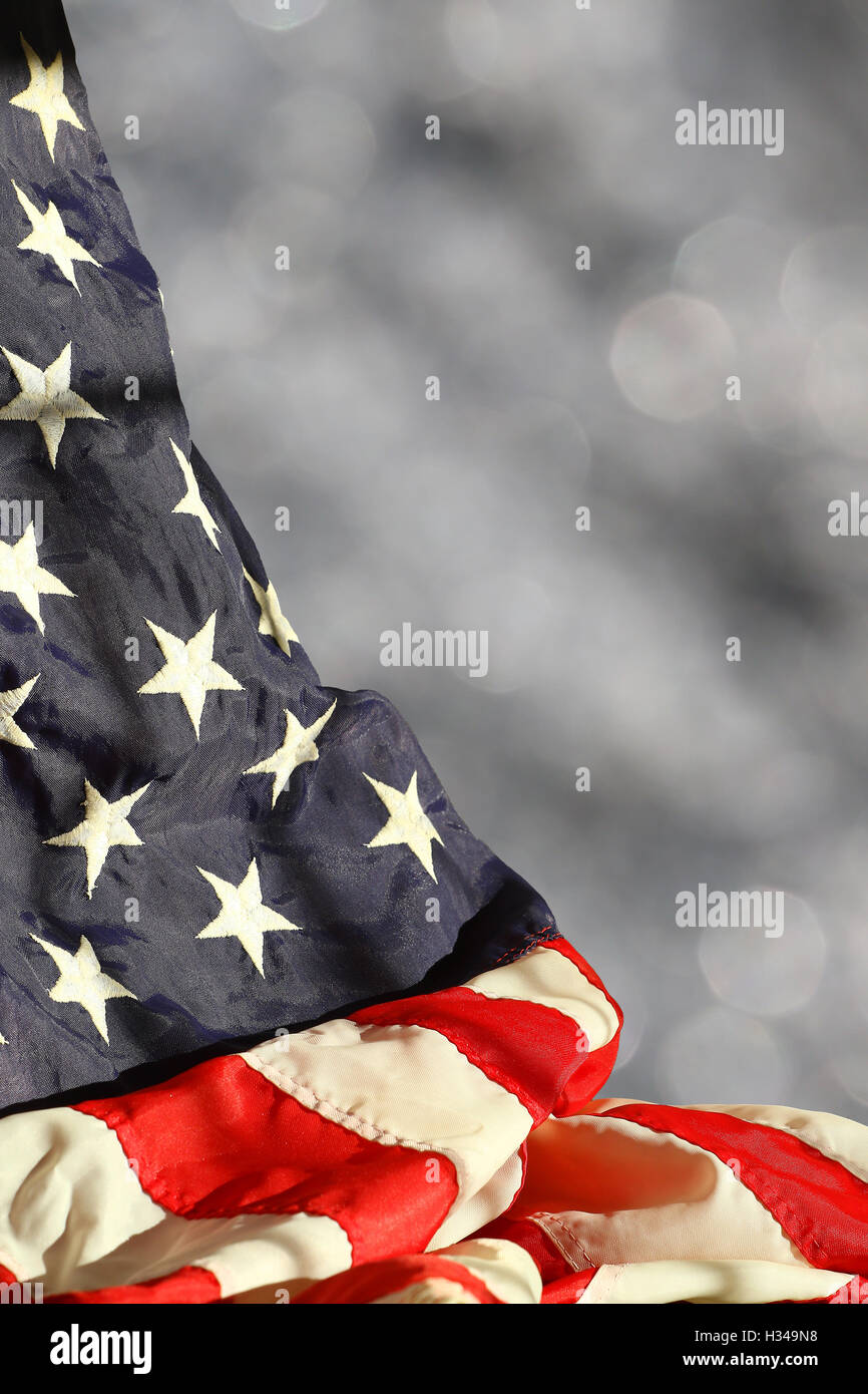 Rippled american flag against blurred sparkling background with space ...