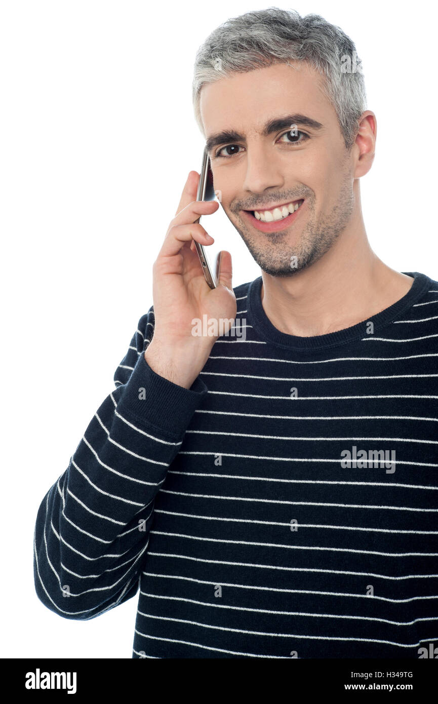 Handsome man communicating with friend Stock Photo - Alamy