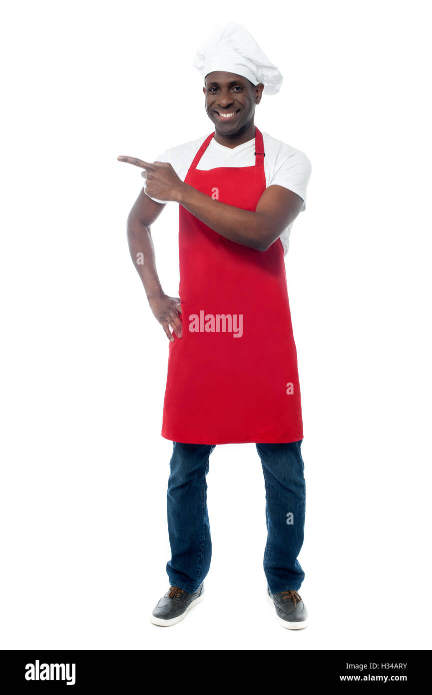 Handsome male chef showing menu Stock Photo - Alamy