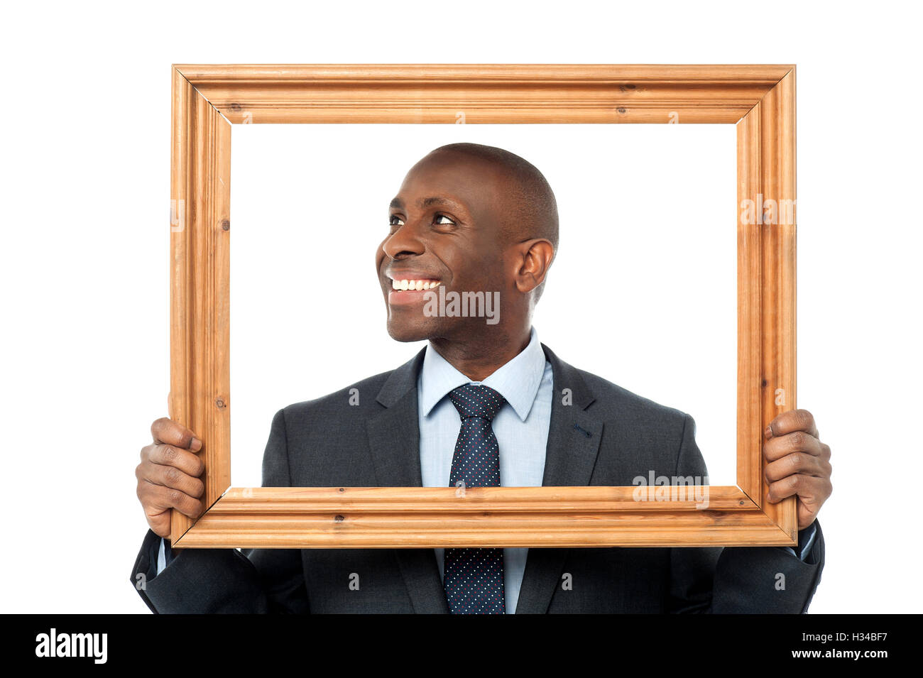 Man holding wooden picture frame Stock Photo - Alamy