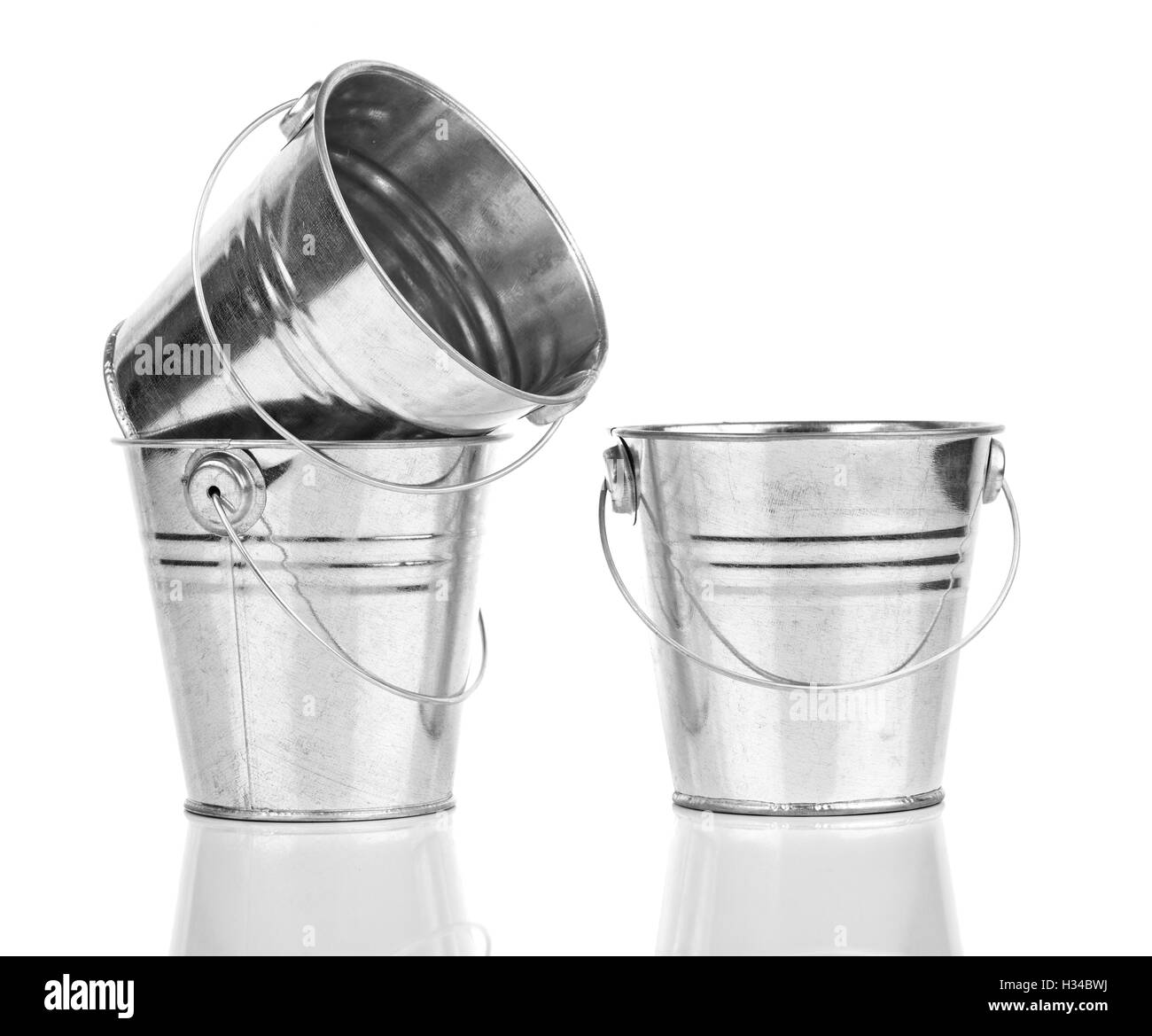 three small bucket, on white background Stock Photo - Alamy