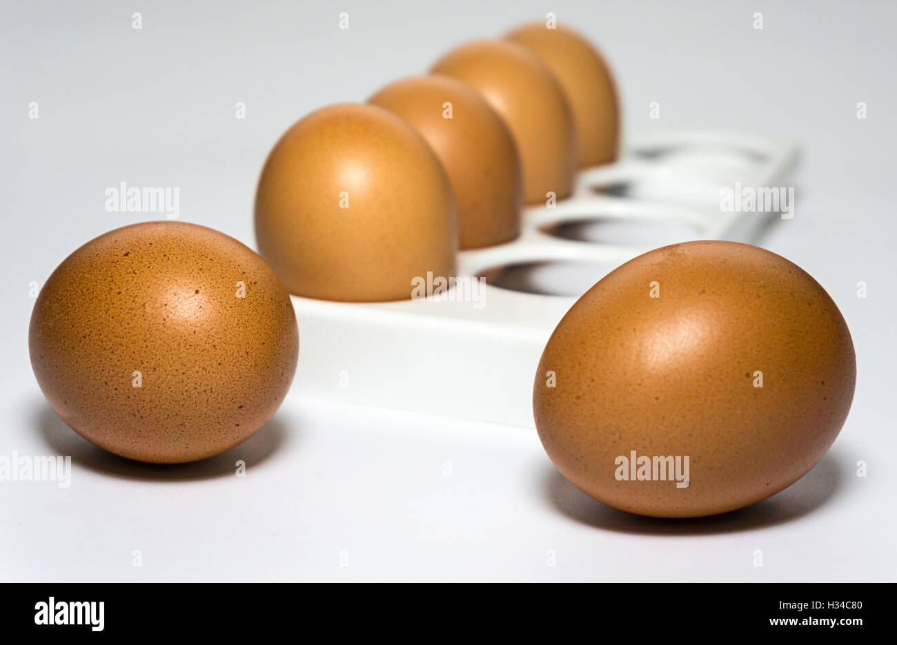 Eggs on white background Stock Photo - Alamy