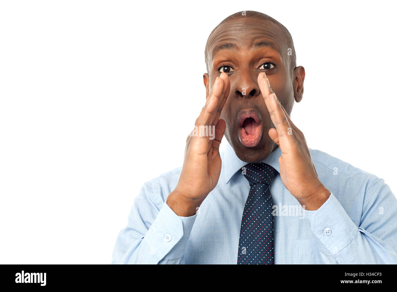 African man with hands to mouth yelling Stock Photo - Alamy