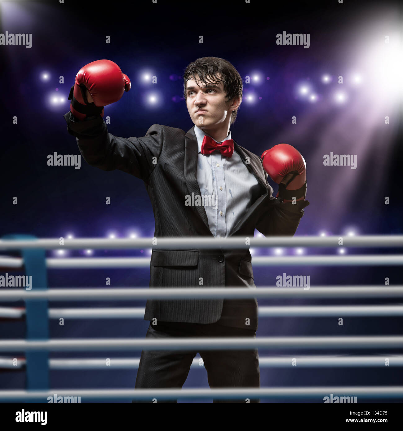 businessman with boxing gloves in the ring Stock Photo - Alamy