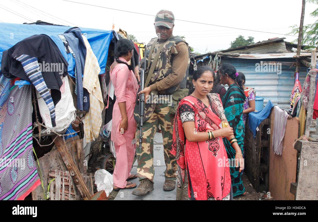 A Force One commando conducts a search and combing operation in a slum ...