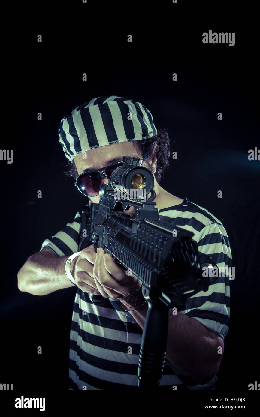 rebel, prisoner in a prison with a machine gun Stock Photo - Alamy