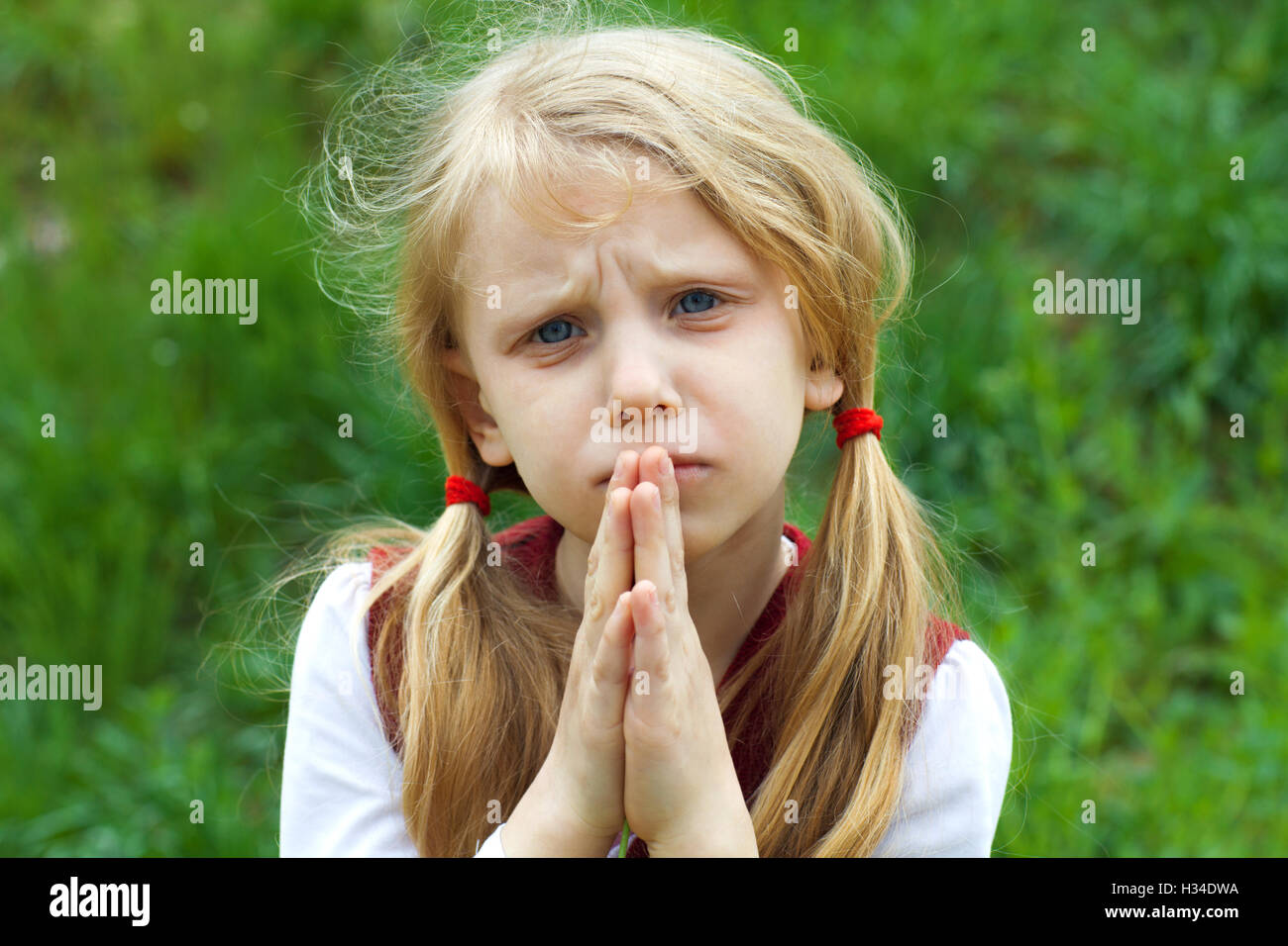 Begging child female pretty hi-res stock photography and images - Alamy