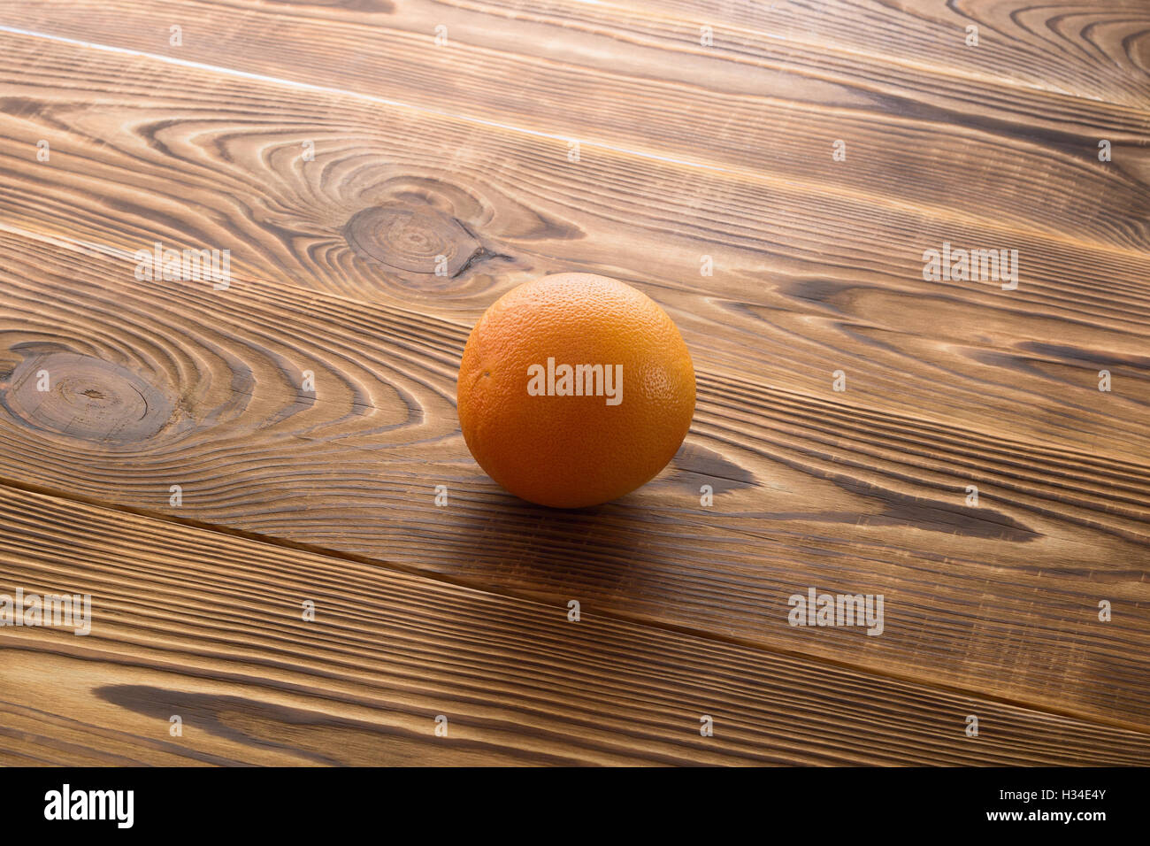 Perfect round fresh ripe grapefruit over brown natural aged wooden ...