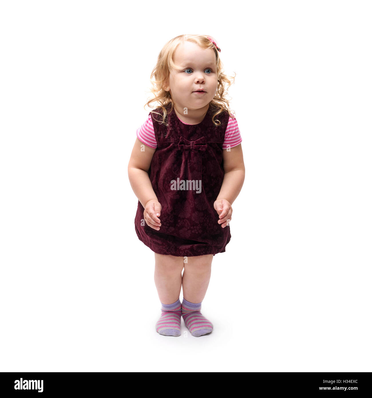 Young little girl jumping over isolated white background Stock Photo ... Young little girl jumping over isolated white background Stock Photo ...