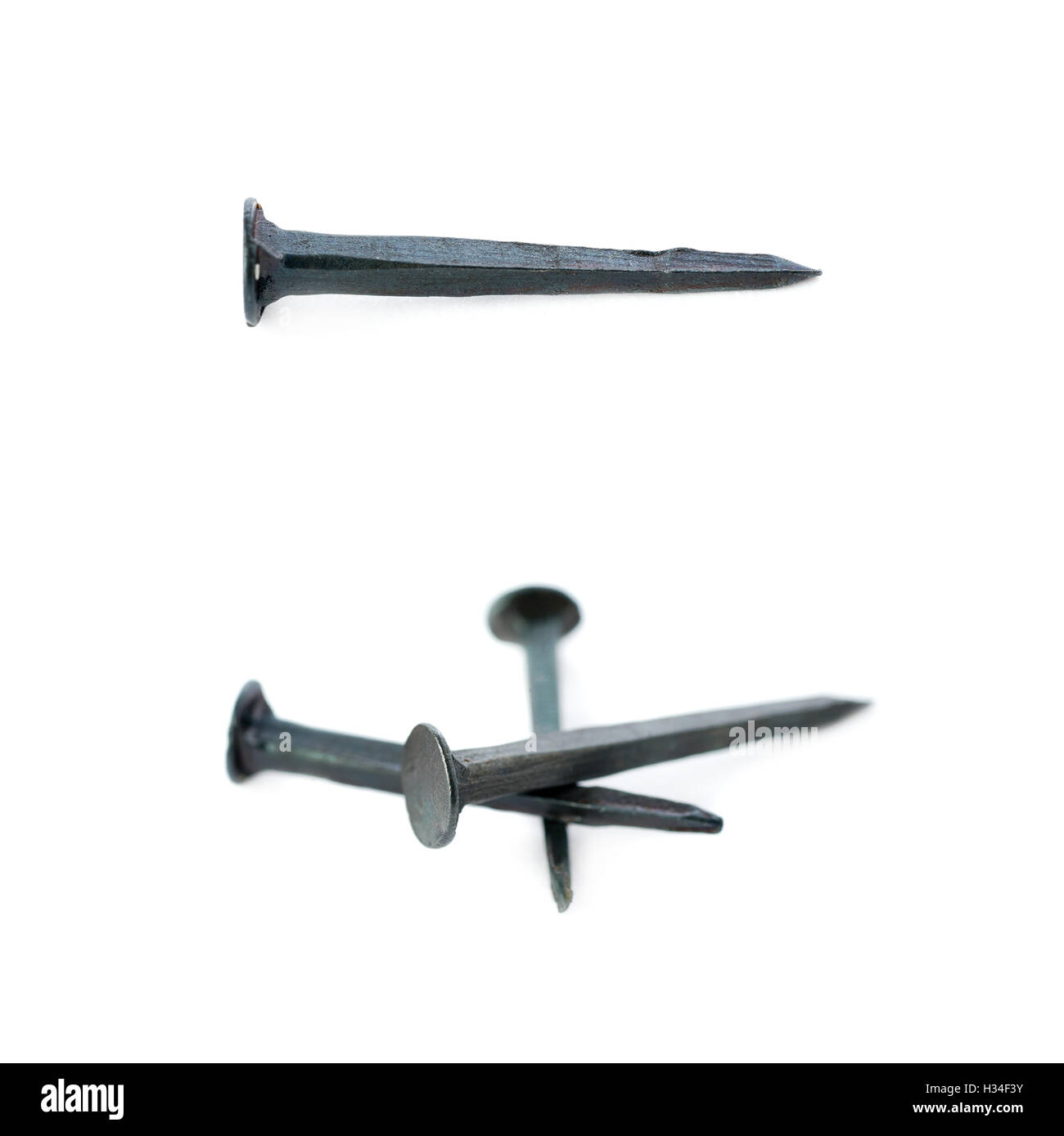 Metal nail isolated over the white background Stock Photo - Alamy