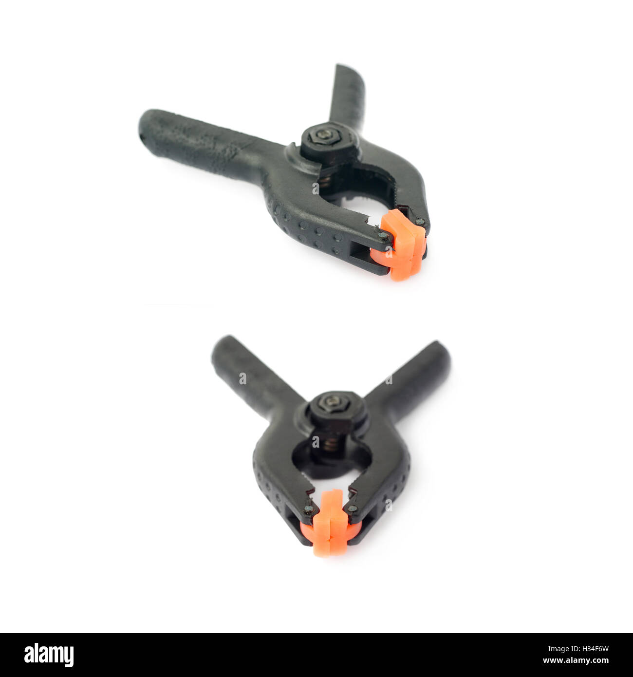 Set of Clamp with orange plastic jaws, isolated over the white ...