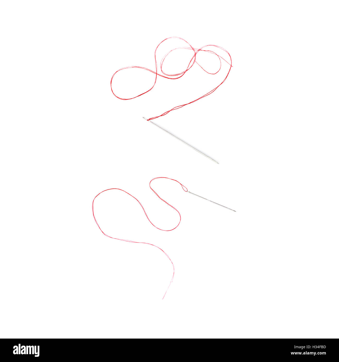 Set of Small needle with thread isolated over the white background ...