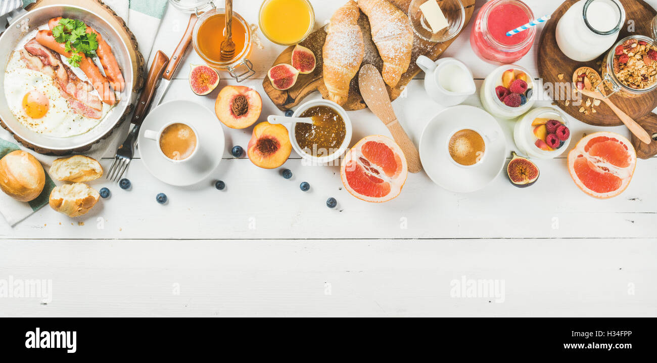 Breakfast snacks and drinks set on white wooden background Stock Photo ...