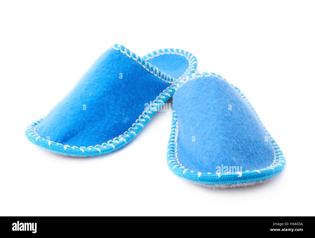 Pair of house slippers isolated over white background Stock Photo - Alamy