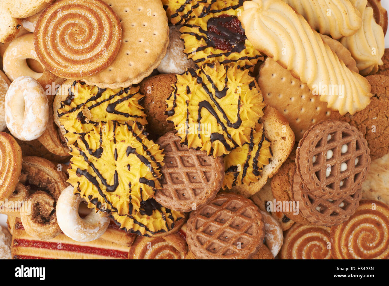 Pile of mix cookies isolated over the white background Stock Photo - Alamy