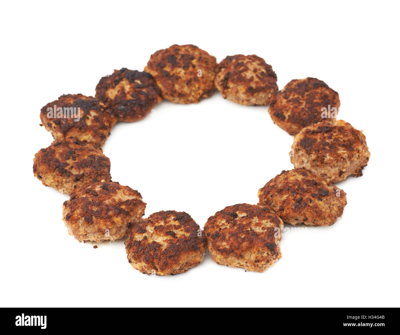 Round shape made of cutlets isolated over white background Stock Photo ...