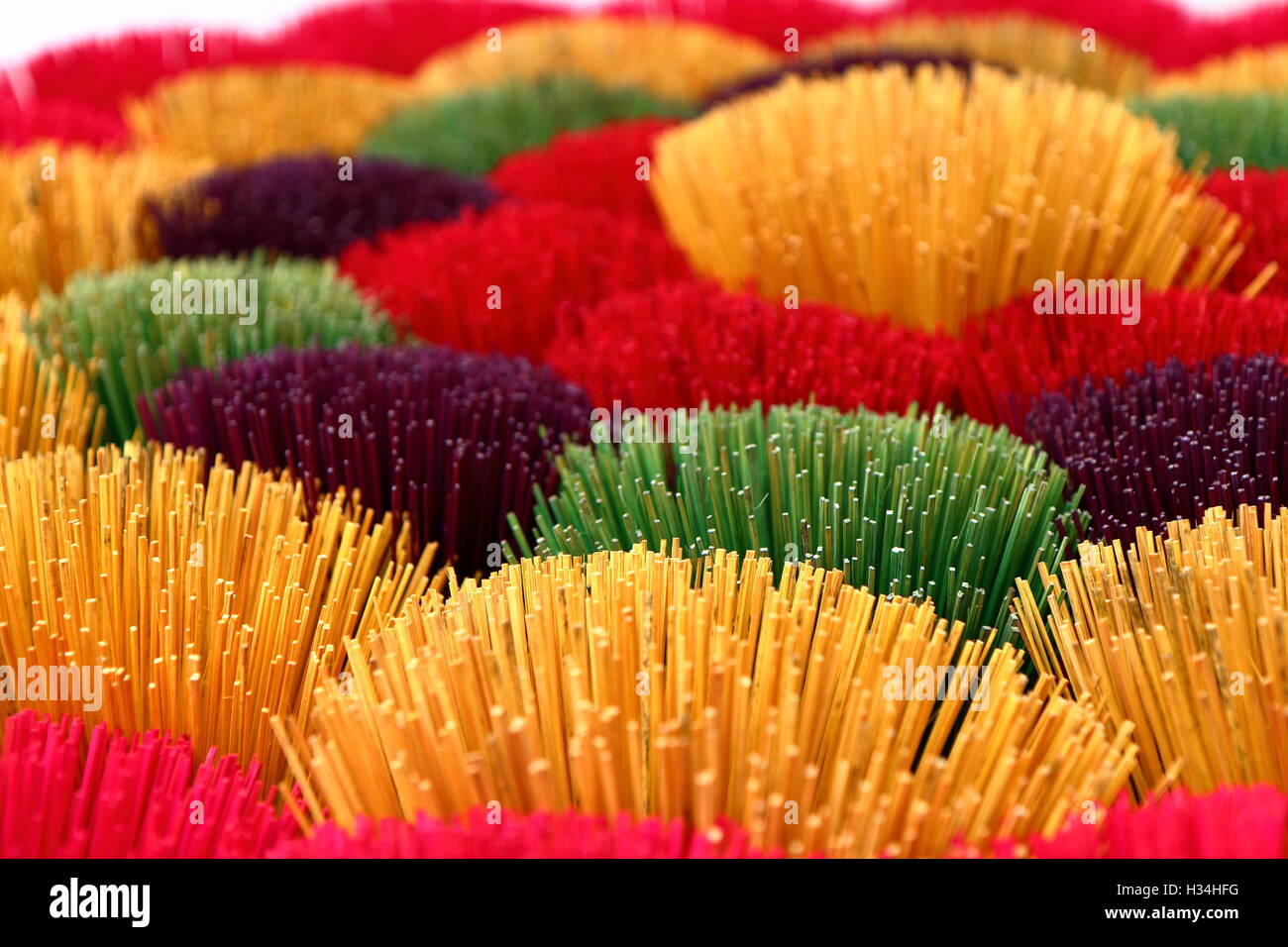 Colored incense sticks Stock Photo - Alamy