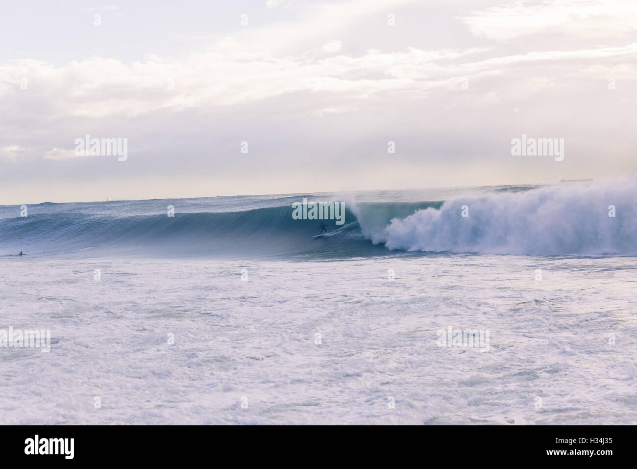 Surfers surfing storm riders ocean waves crashing water power landscape ...