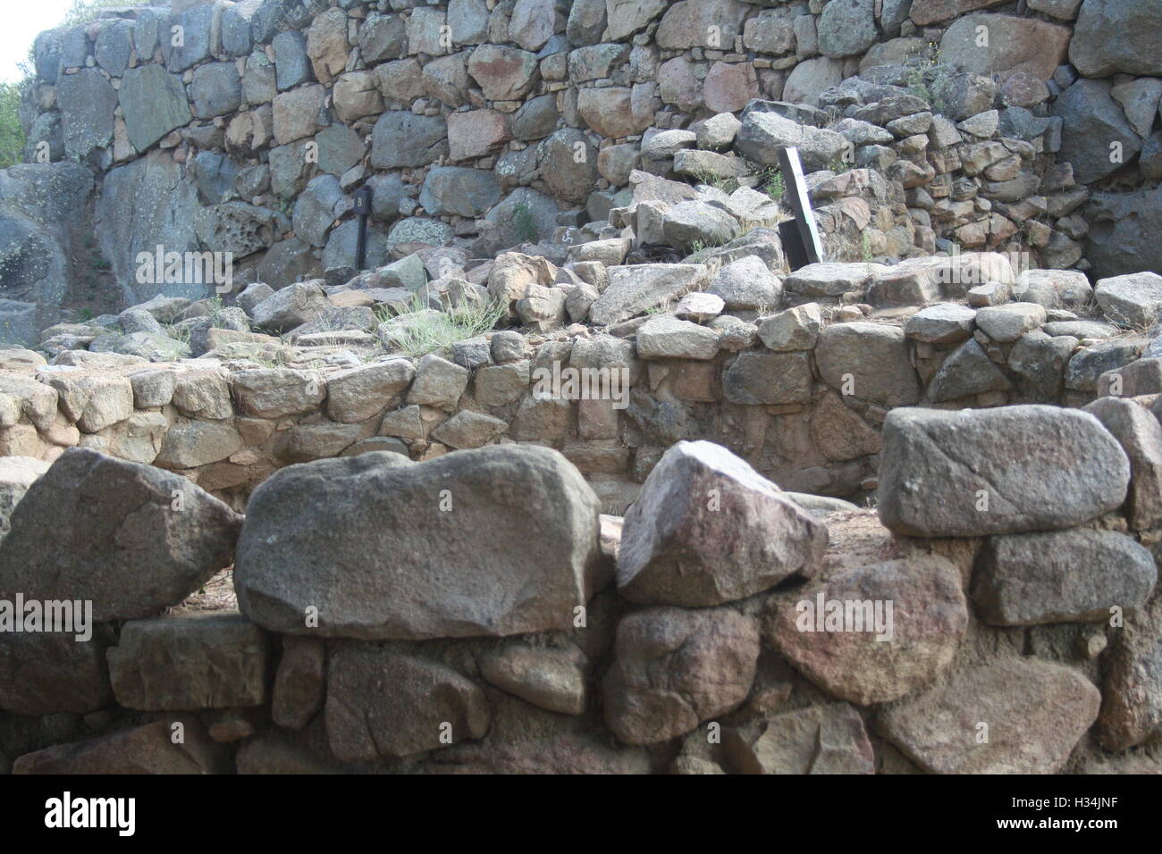 An old stone build wall at an old castle in Sardinia Italy Stock Photo ...