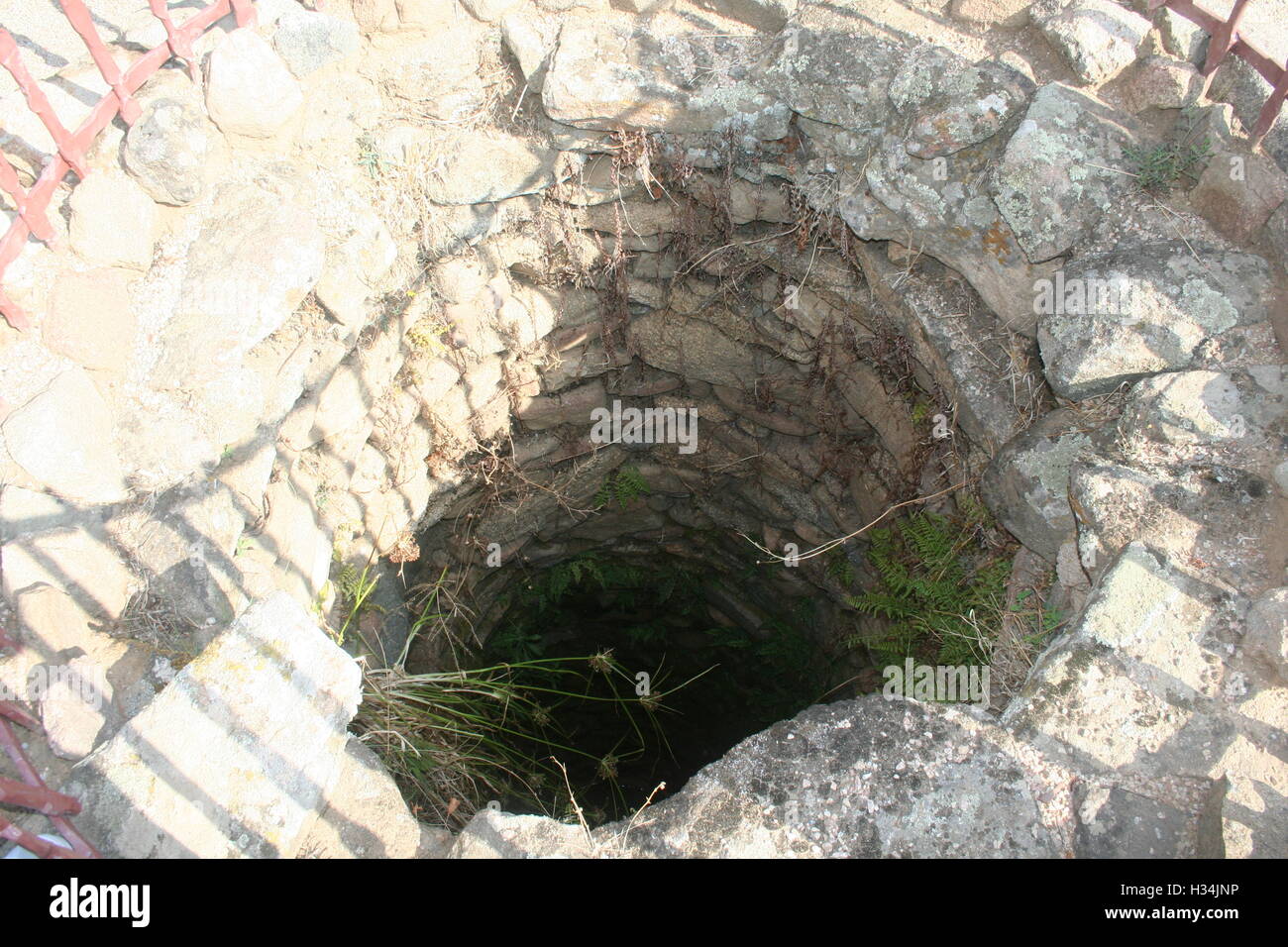 An old well at an old Castle in Sardinia Italy Stock Photo - Alamy