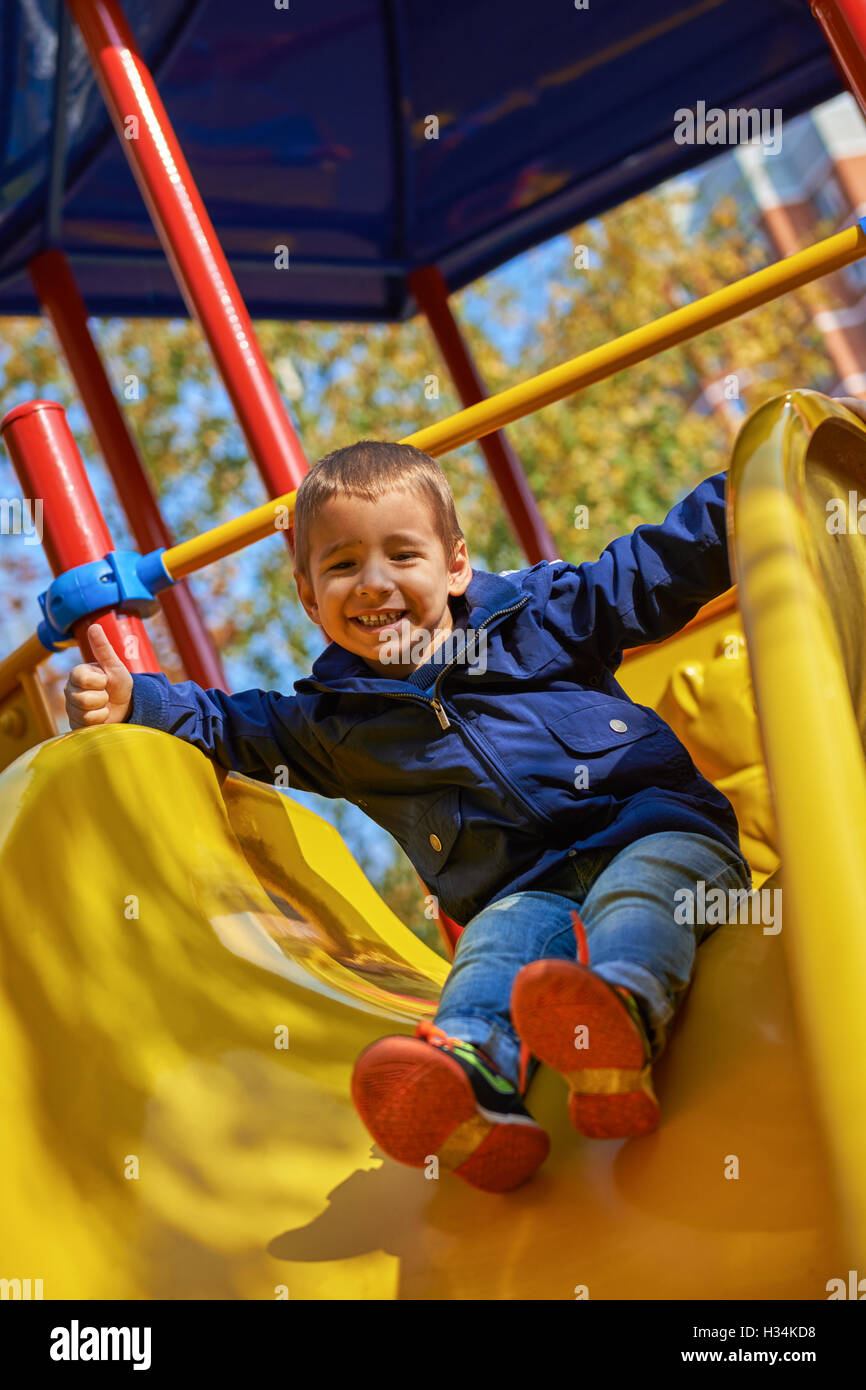Portrait of a happy child on the playground Stock Photo - Alamy