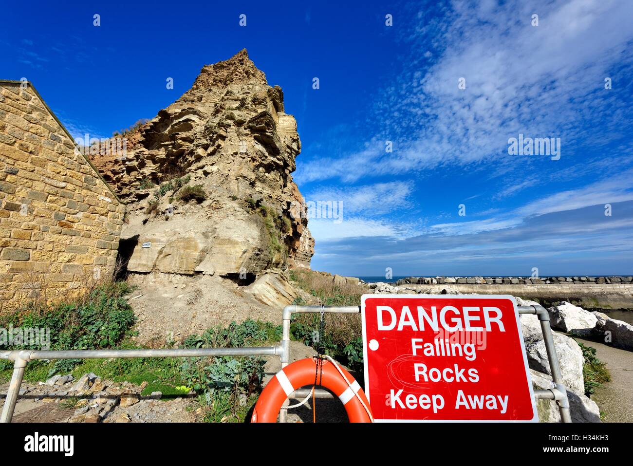 Danger falling rocks warning sign Cowbar nab Staithes North Yorkshire ...