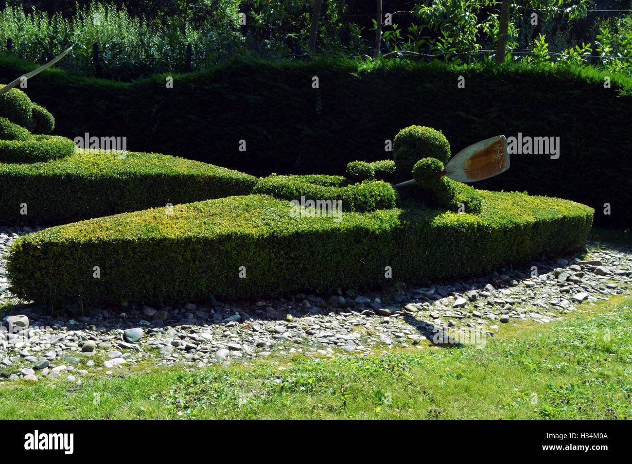 Kayak to make in natural box tree with a kayaker which hold a paddle ...