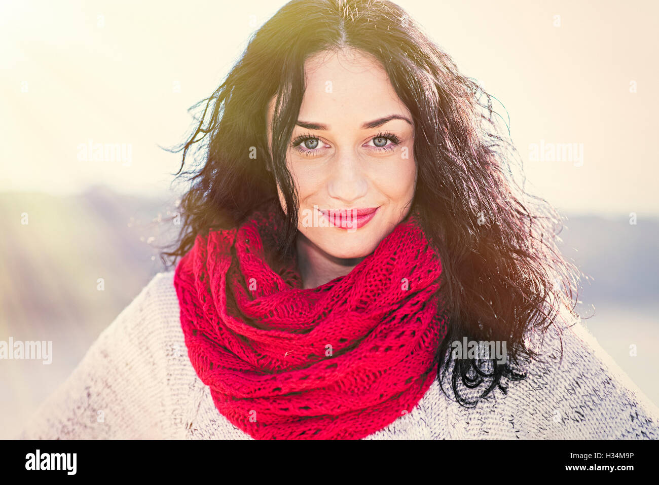 Cute young woman with red scarf in the park Stock Photo - Alamy