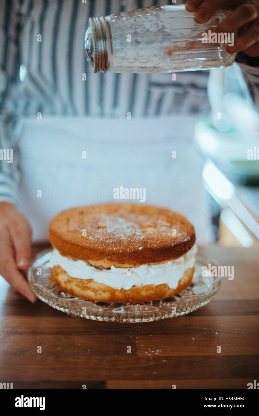 Woman with a beautiful baked cake Stock Photo - Alamy