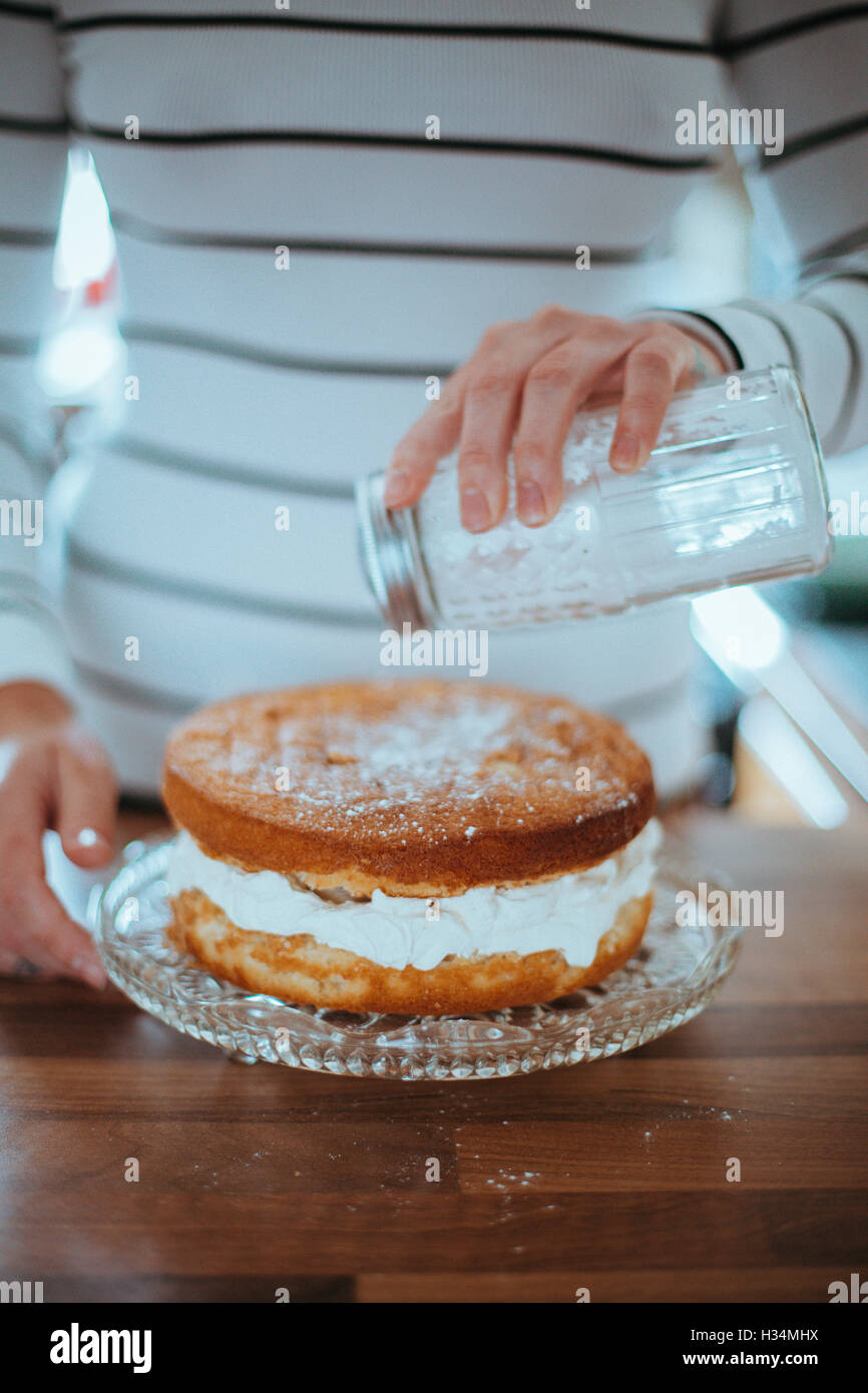 Woman with a beautiful baked cake Stock Photo - Alamy