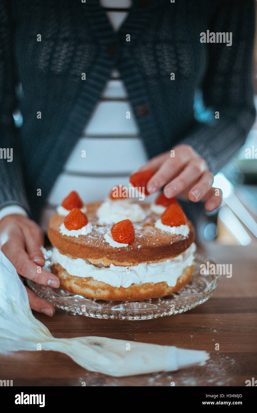 Woman with a beautiful baked cake Stock Photo - Alamy