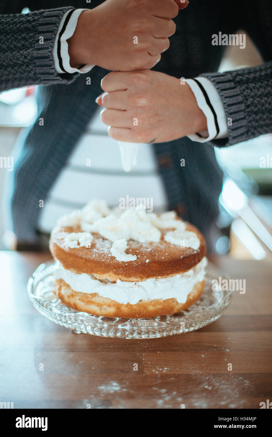 Woman with a beautiful baked cake Stock Photo - Alamy