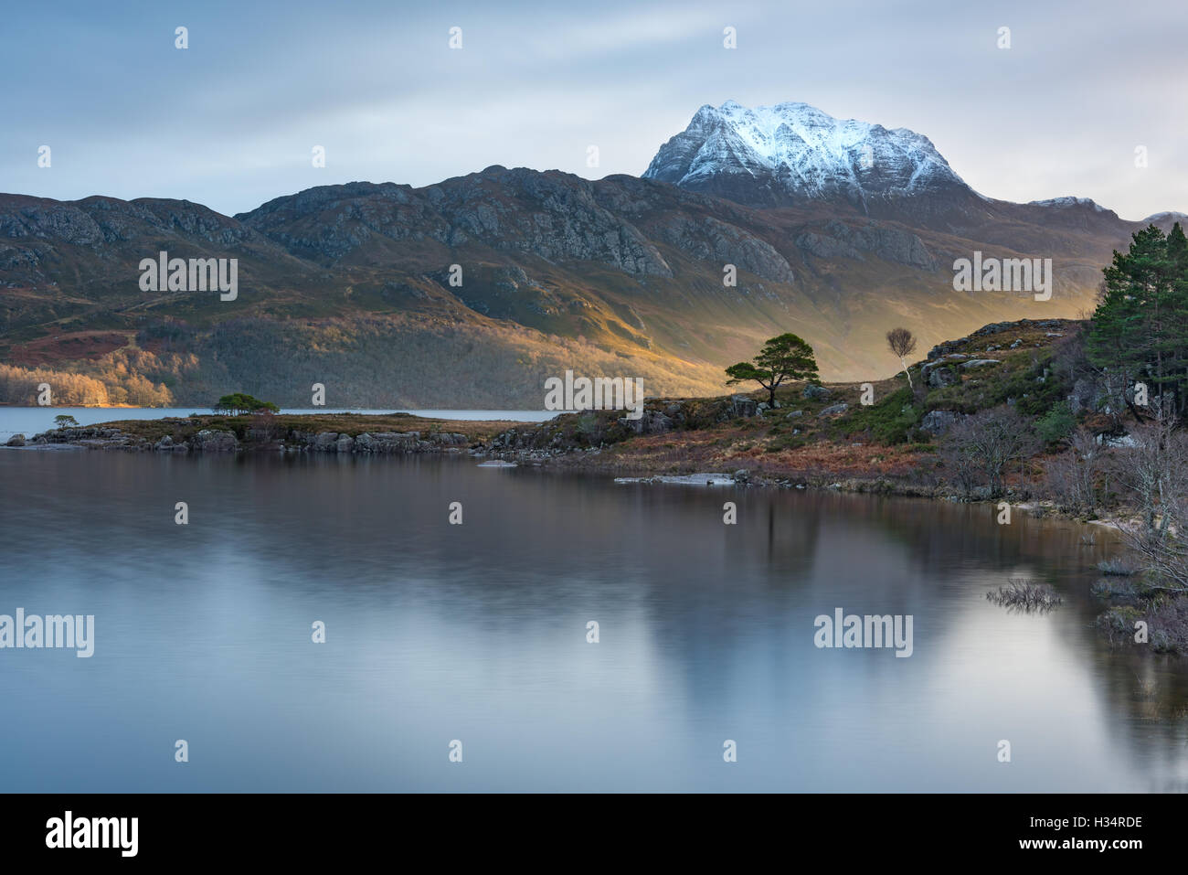 Burst of sunlight over Slioch and Loch Maree, Scottish Highlands ...