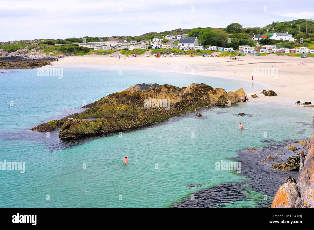 The sandy beach and beautiful rocky coastline with blue water on Route ...