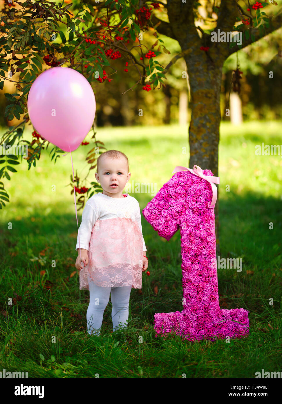 little girl with balloon and big one Stock Photo - Alamy