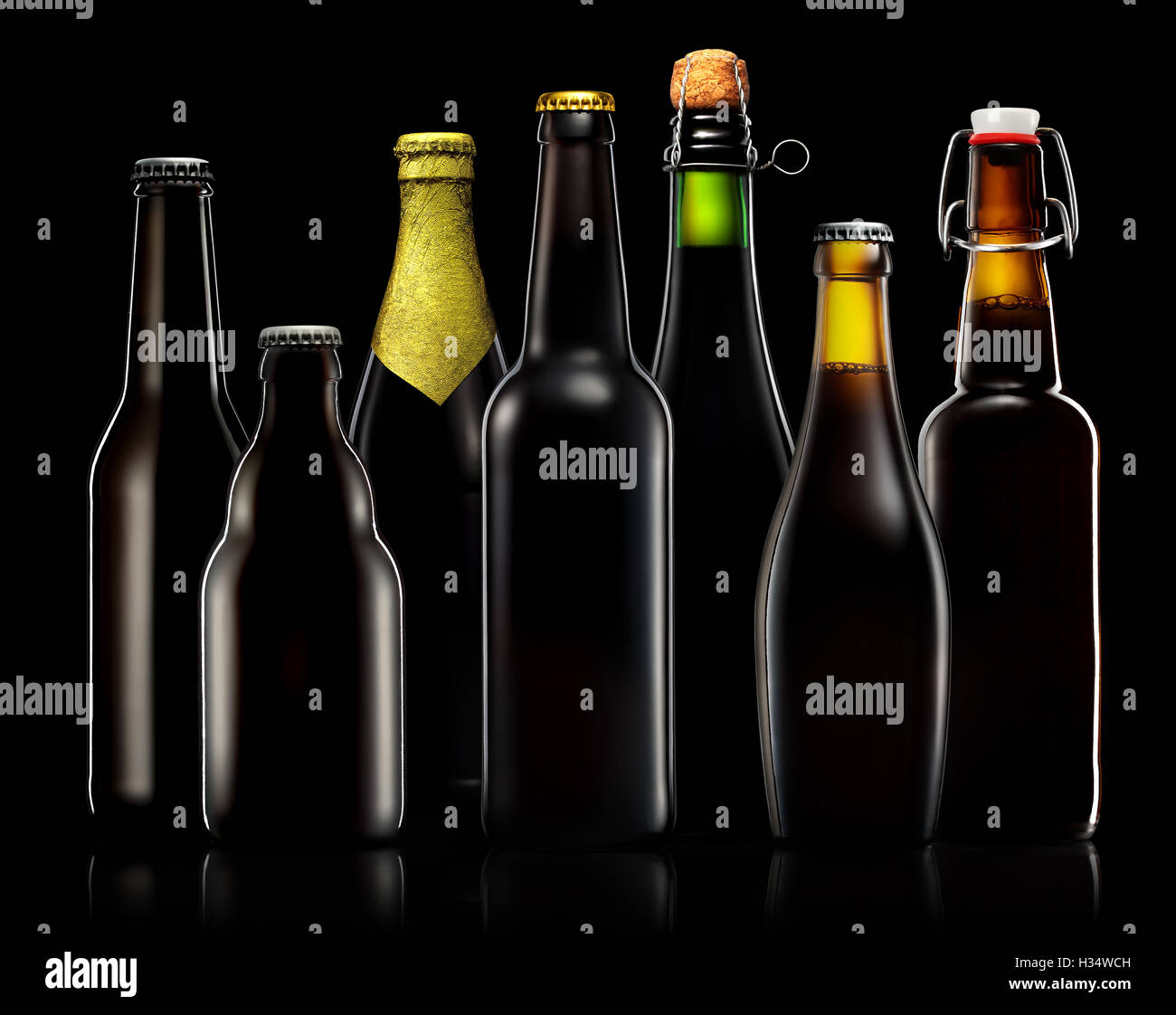 Set of beer bottles isolated on black background Stock Photo - Alamy