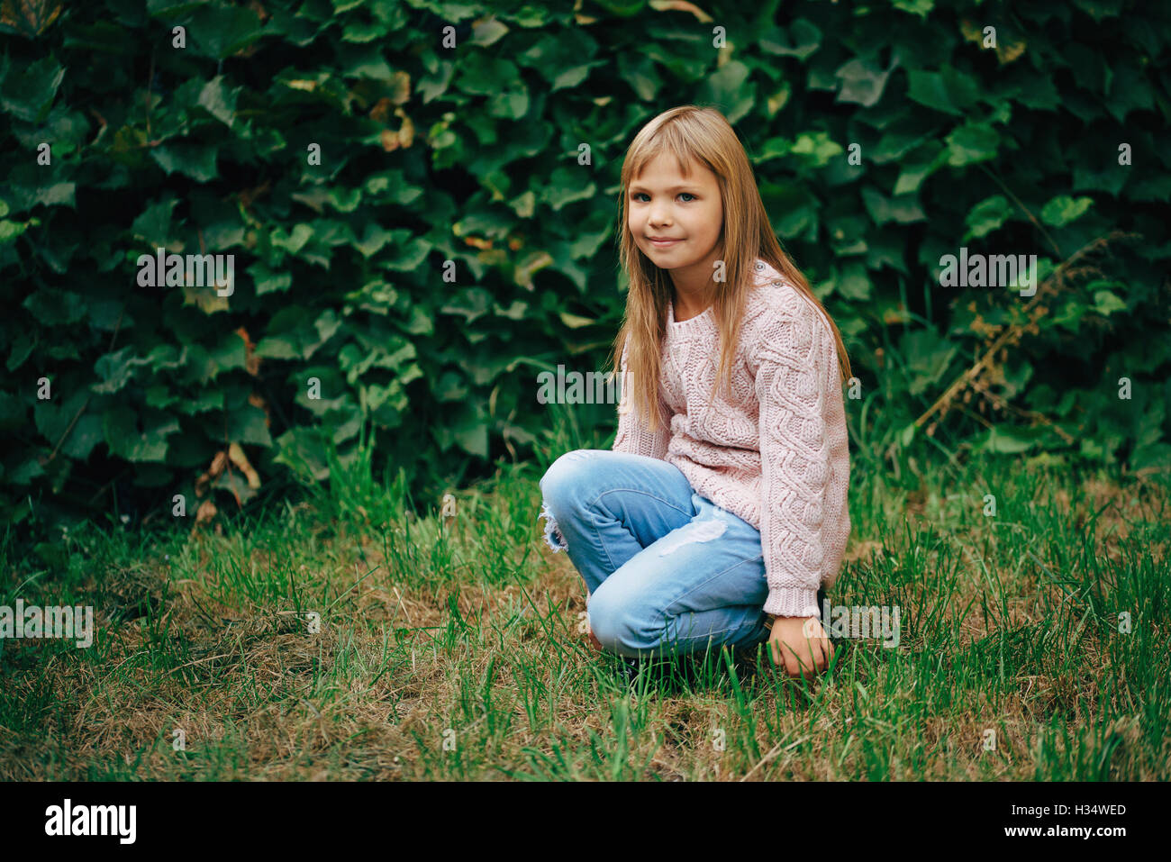 beautiful young girl posing on the street Stock Photo - Alamy