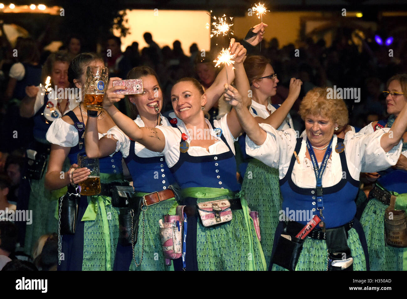 Servers celebrating in the Hofbraeu tent during the finale of the 183rd ...