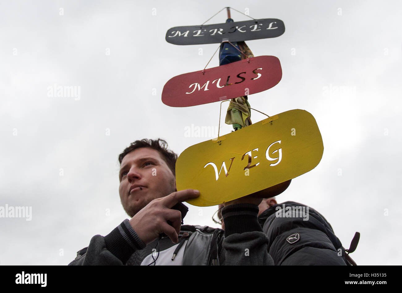 Dresden, Germany. 3rd Oct, 2016. A Pegida supporter protesting with a ...