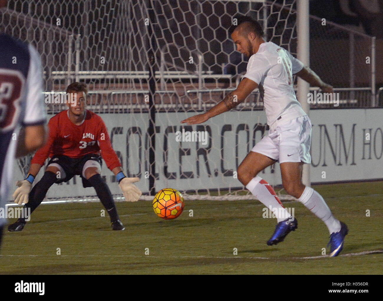 Usa. 4th Oct, 2016. SPORTS -- UNM's Niko Hansen takes a goal shot that is caught by Loyola ...