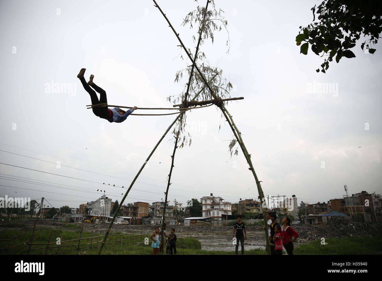 Kathmandu, Nepal. 5th Oct, 2016. A Nepalese girl plays swing made of ...
