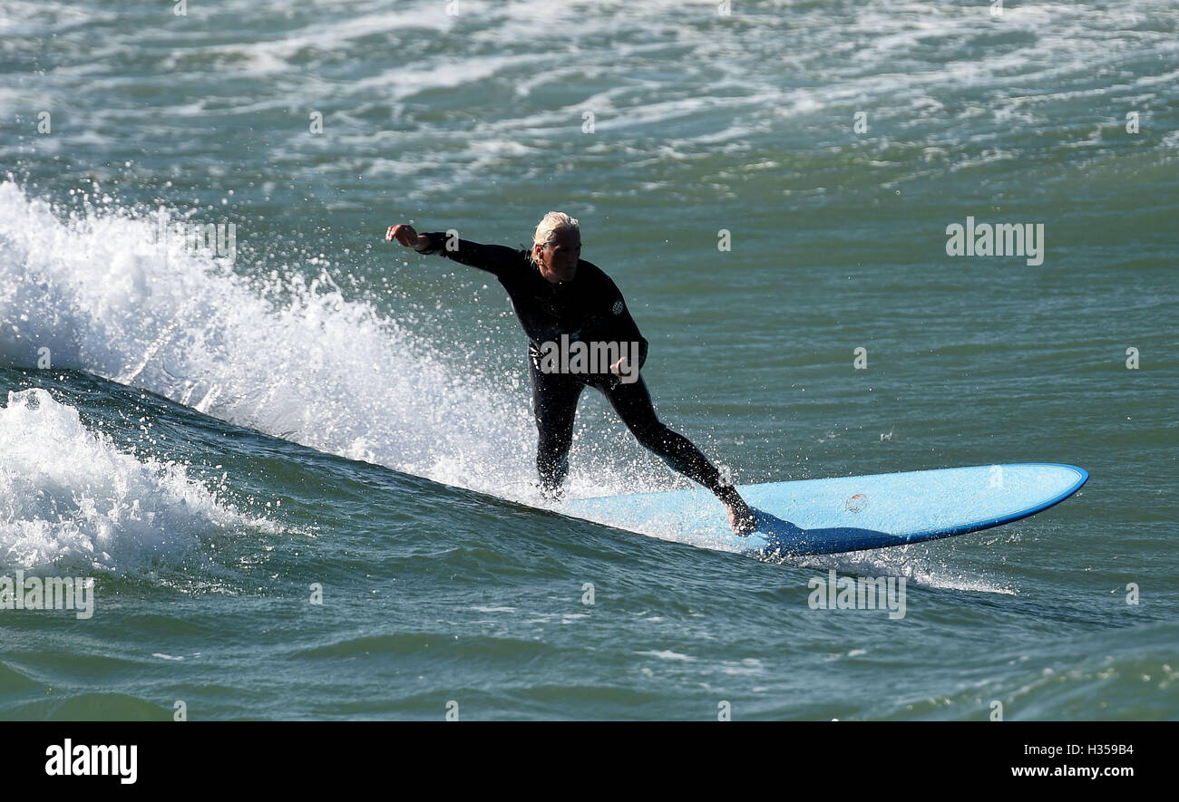 Surfers surfing at Bournemouth Beach, Dorset, UK Stock Photo - Alamy