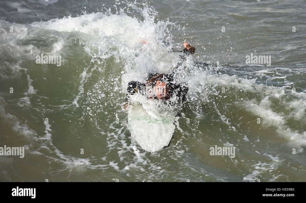 Surfers surfing at Bournemouth Beach, Dorset, UK Stock Photo - Alamy