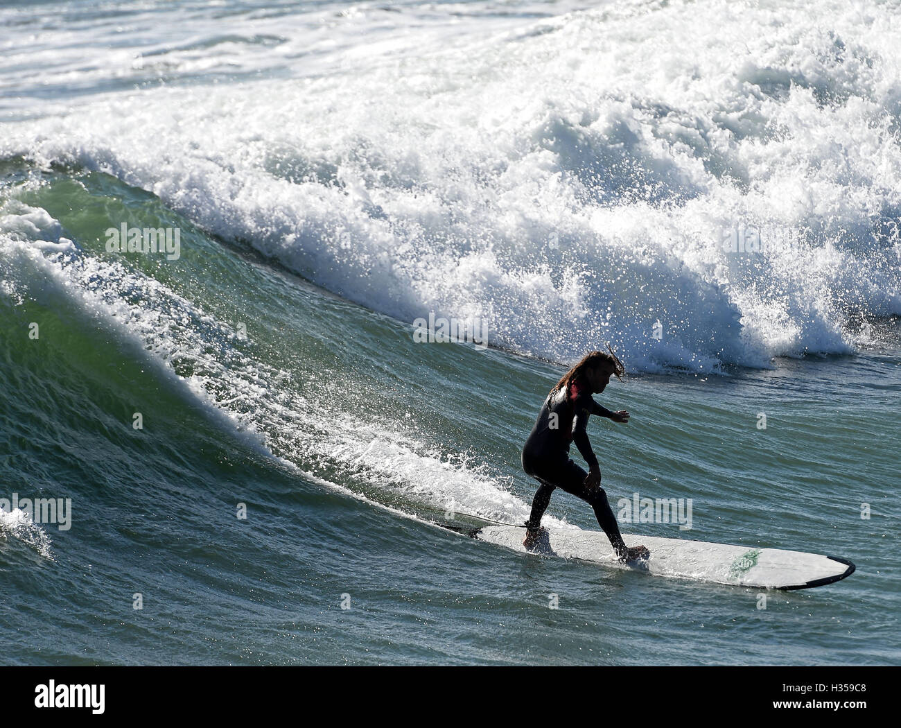 Surfers surfing at Bournemouth Beach, Dorset, UK Stock Photo - Alamy