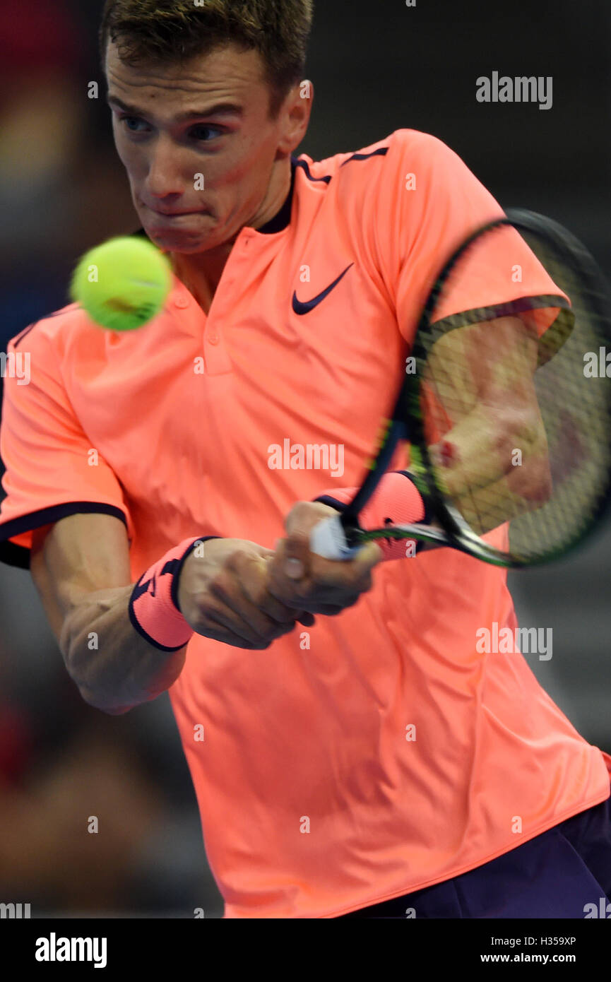 Beijing, China. 5th Oct, 2016. Andrey Kuznetsov of Russia hits a return to Andy Murray of ...