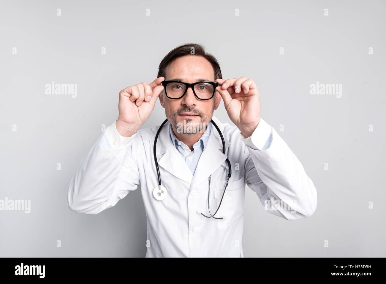 Handsome doctor hi-res stock photography and images - Alamy