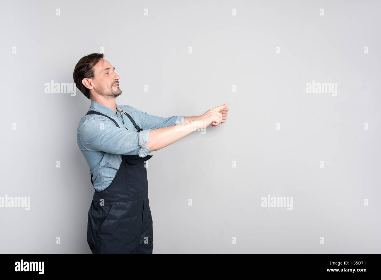 Positive man working Stock Photo - Alamy