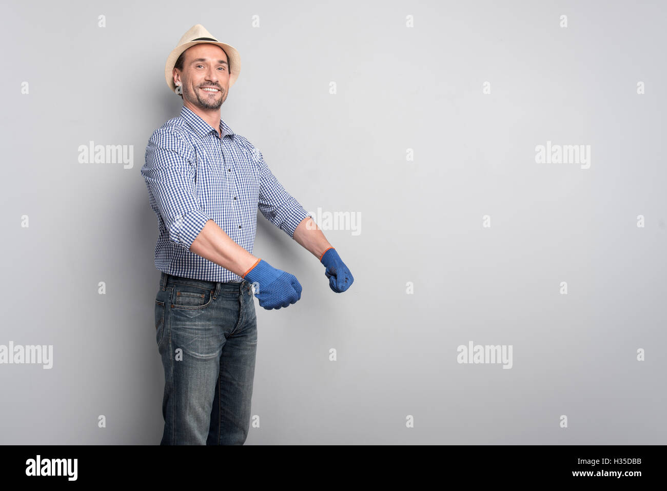 Positive nice man standing confidently Stock Photo - Alamy