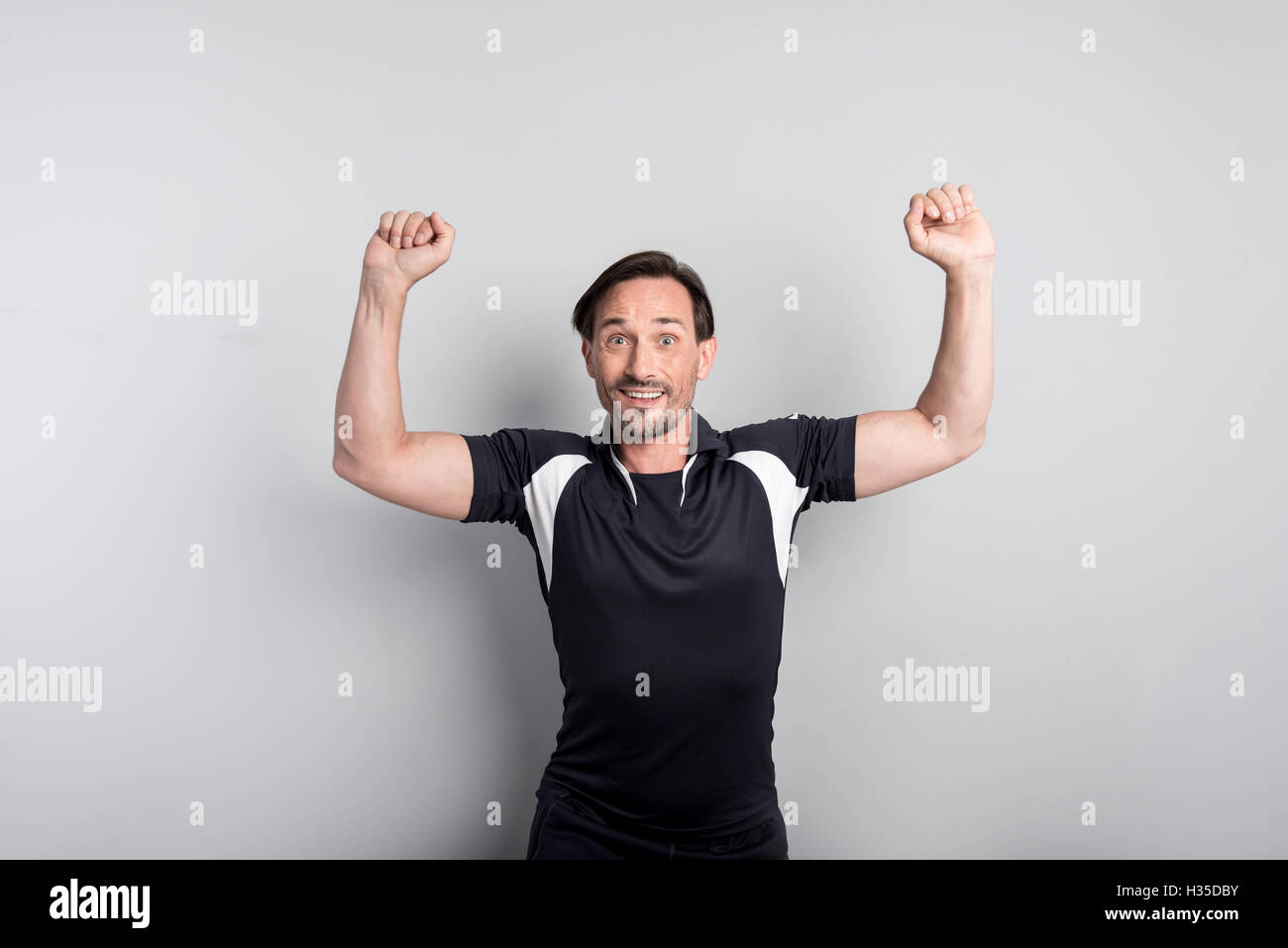 Man showing his muscles hi-res stock photography and images - Alamy